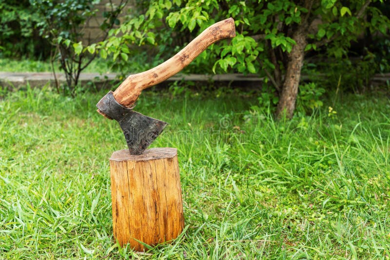 Antique sharp ax in a log stock photo. Image of rust - 258042834