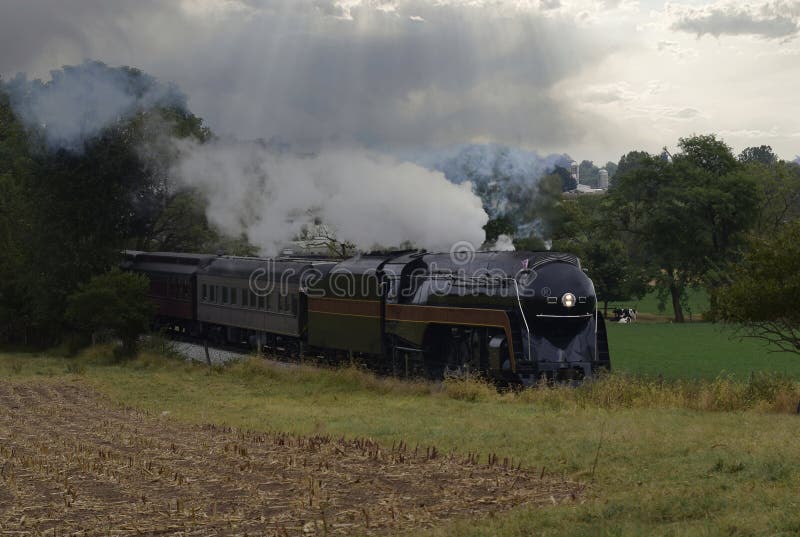 Antique Steam Engine Approaching with Passenger Coaches Stock Photo ...