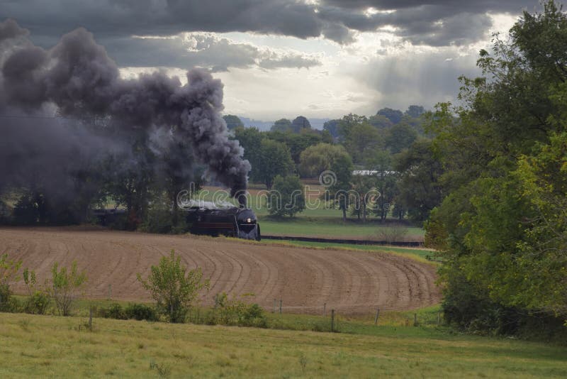 Antique Steam Engine Approaching with Passenger Coaches Stock Photo ...