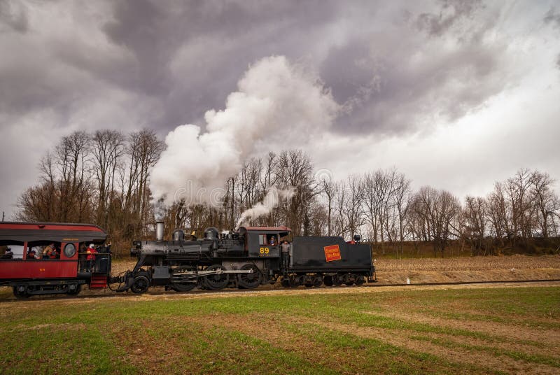 Antique Steam Engine Running Backwards Pulling a String of Passenger ...