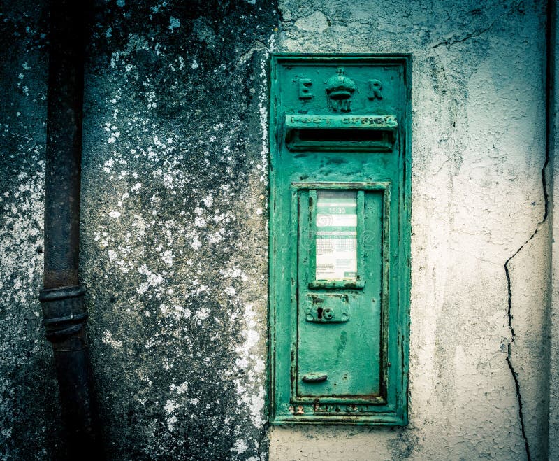 A Mail Box on the Side of a Stone Wall with a Rusted Metal Handle Stock ...