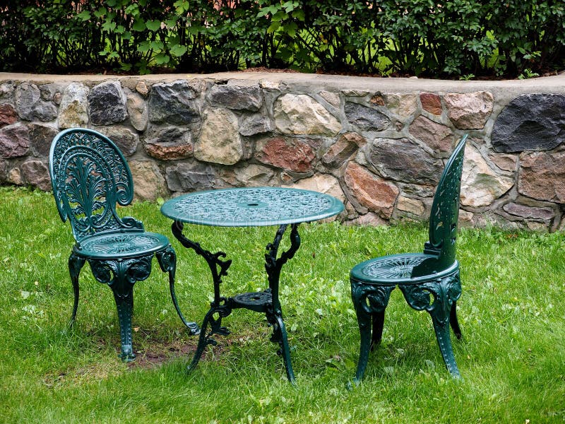 Antique Table and Chairs with Stone Wall Stock Photo - Image of chairs ...