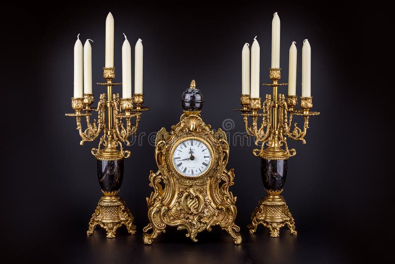 Antique Table Clock and Two Candlesticks with Candles Stock Image ...