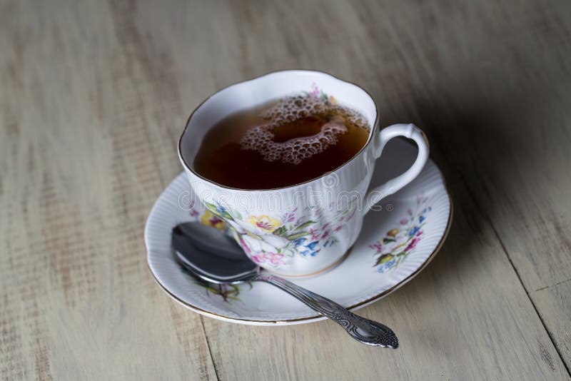 Antique Tea Cup Full of Tea on Wood Background Stock Image - Image of ...