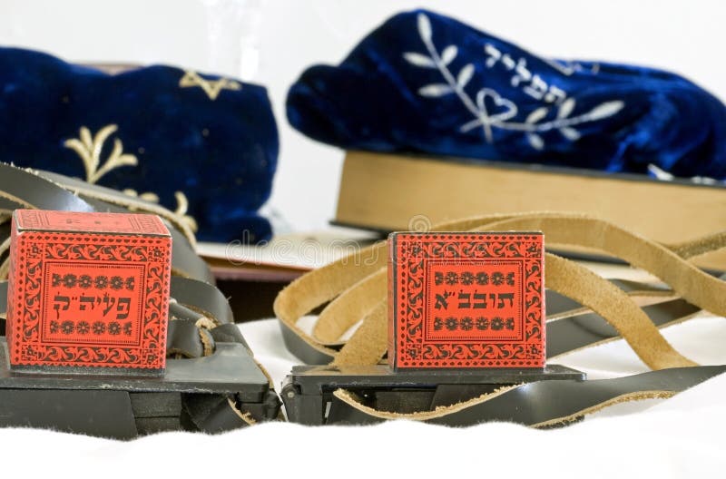 A Set of Tefillin with Verses from Torah Written on Them and a Pouch ...