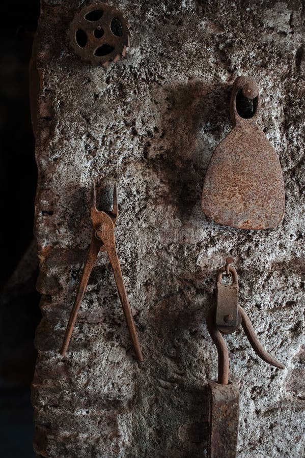 Antique Various Tools on Stone Wall Stock Photo - Image of iron, inside ...