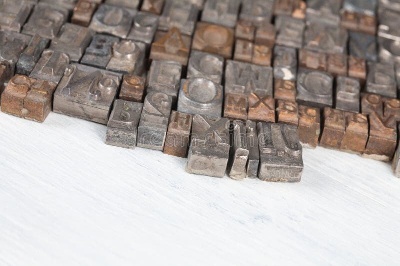Antique Vintage Movable Type Alphabet Set on White Wooden Deck Stock ...