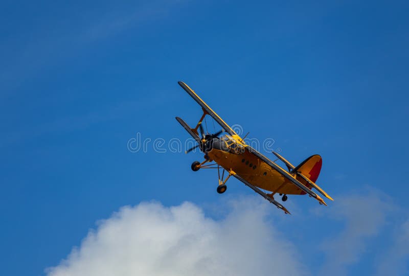 Antonov an-2 Biplane Fly on Cloudy Sky. Old Yellow Historic Plane from ...