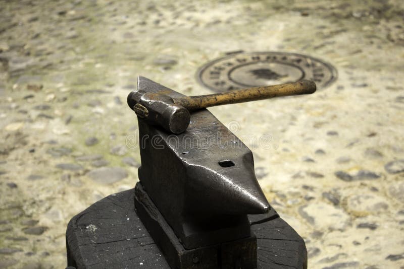 Anvil and forging hammer stock photo. Image of hand - 179895848