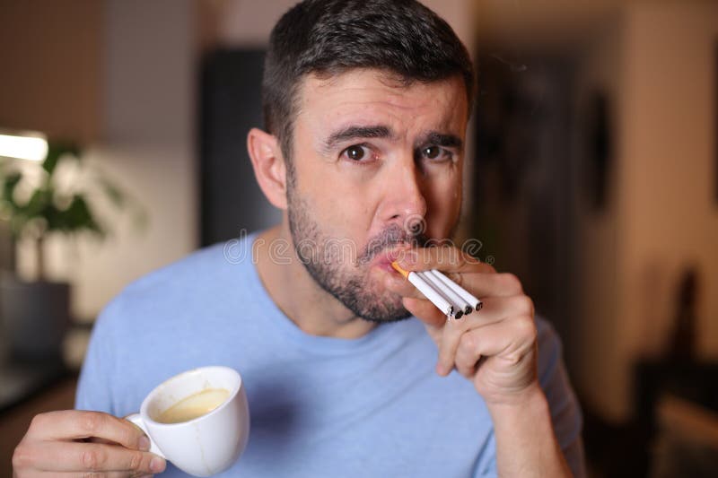 Anxious Looking Man Smoking Four Cigarettes at the Same Time and ...
