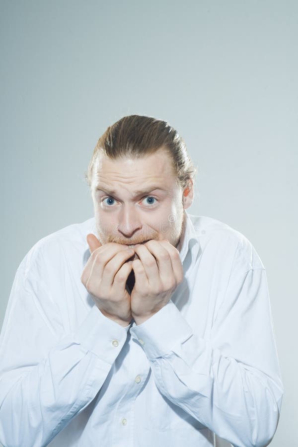 Anxious Man Chewing on Fingernails Stock Photo - Image of discontent ...