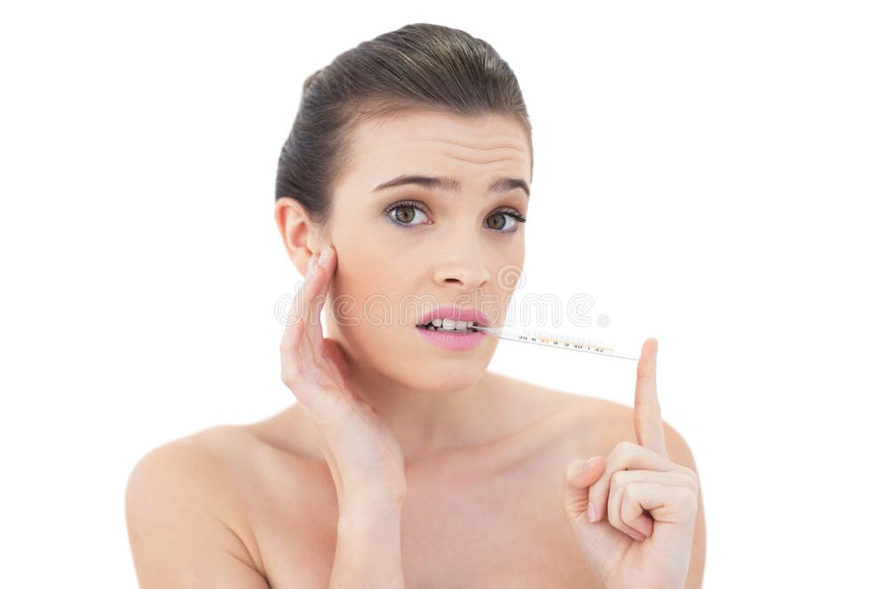 Anxious Natural Brown Haired Model Using a Thermometer Stock Image ...