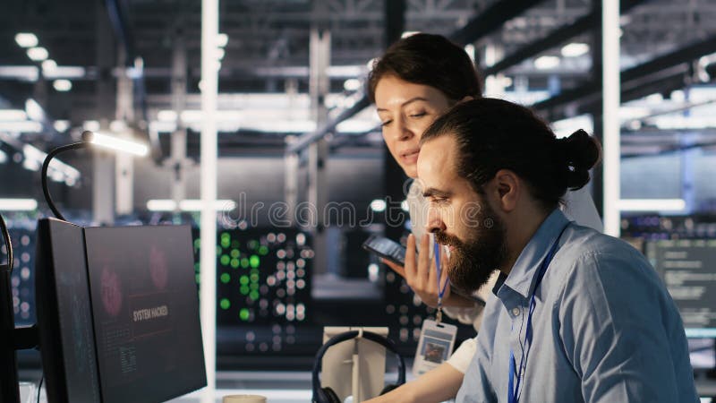 Anxious Technicians in Data Center Reacting To System Lockdown Caused ...