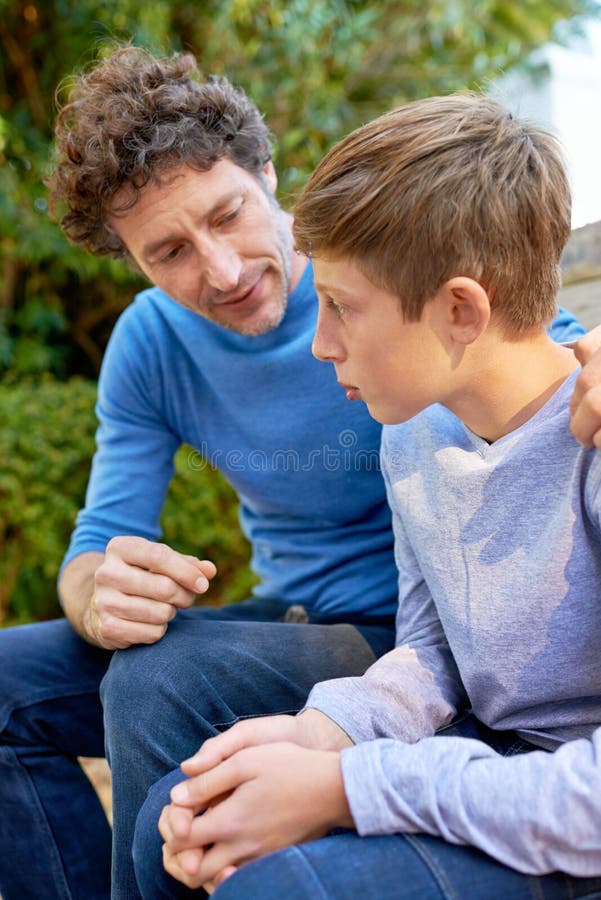 Any Questions. a Father and Son Having a Heart To Heart in the Backyard ...