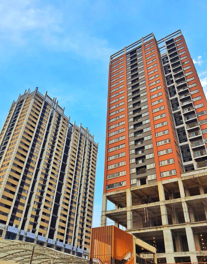 An Apartment Building that is almost Finished Its Construction Process ...