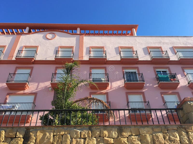 Apartment Building with a Pink Facade Stock Photo - Image of town ...