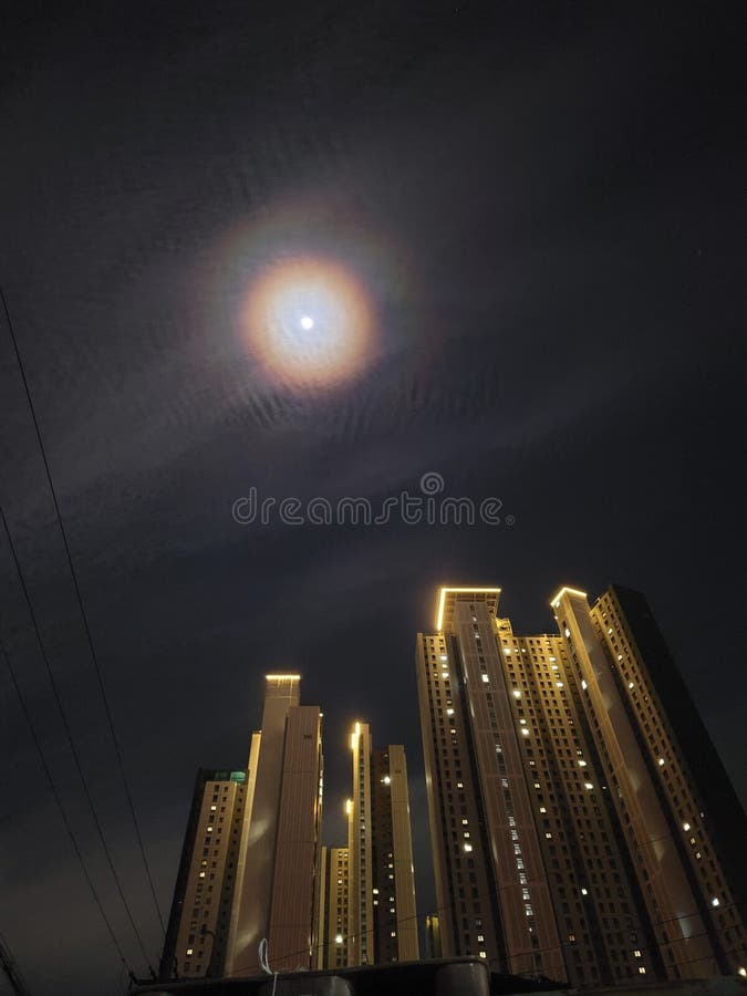 Apartment Buildings and the Moon Shines Beautifully at Night Stock ...