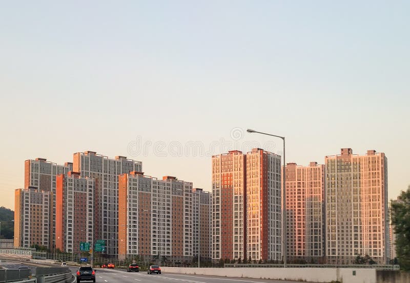 Apartment Complex by the Highway Under Sunset Stock Photo - Image of ...
