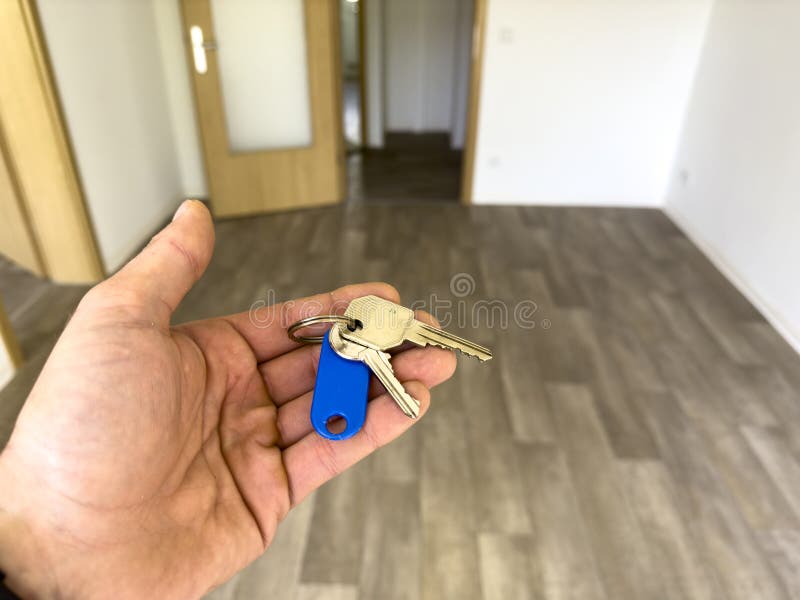Apartment Key in Hand in a New Apartment when Moving in Stock Photo ...