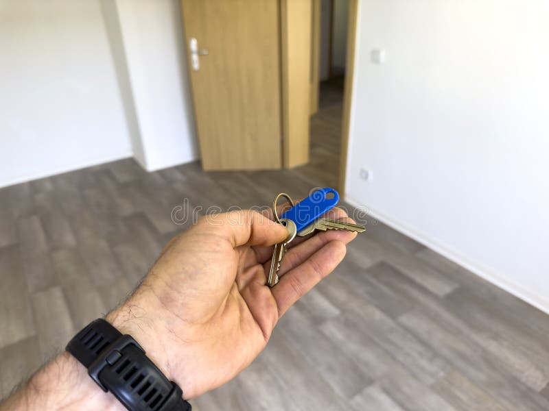 Apartment Key in Hand in a New Apartment when Moving in Stock Photo ...
