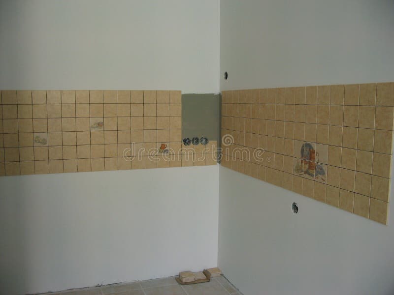 Kitchen Apron Lined with Wall Tiles with Drawings. Stock Image - Image ...