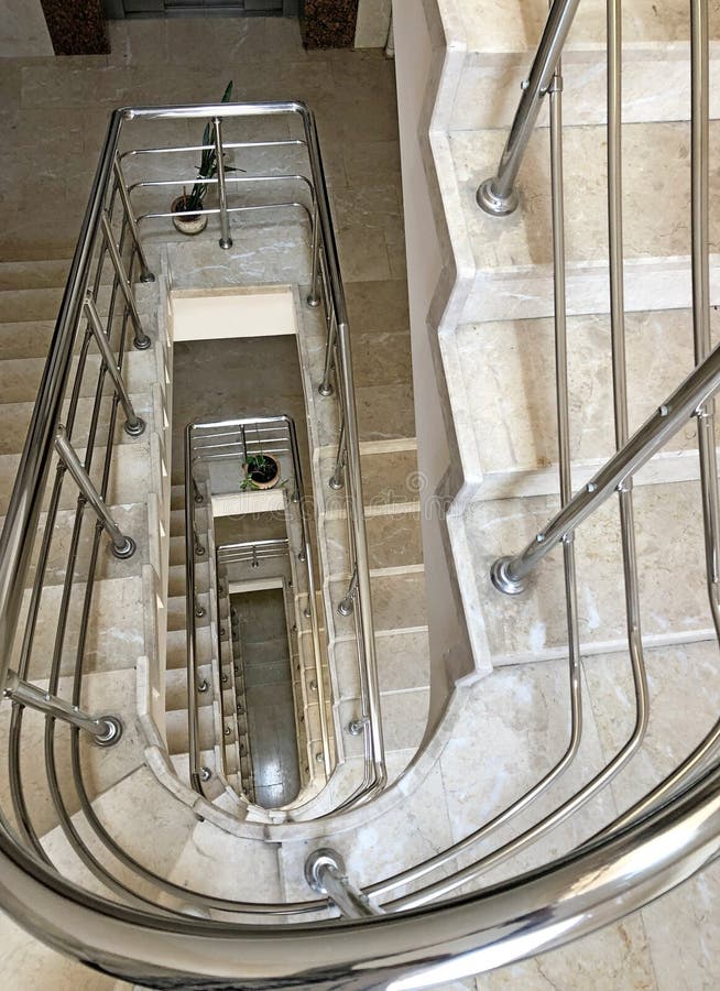 Apartment Staircase with Marble Cladding and Steel Handrails ...