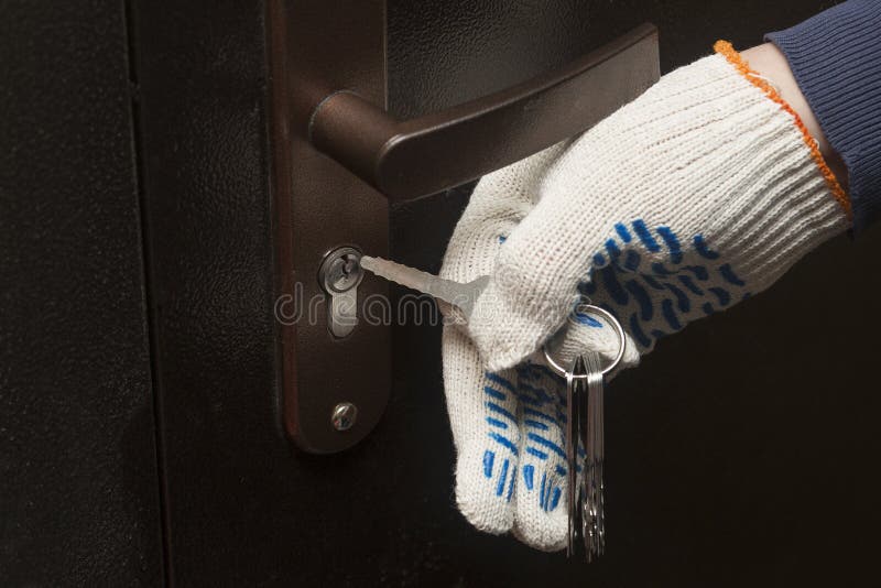 Apartment Theft. the Thief Breaks Down the Door of the House To Break ...