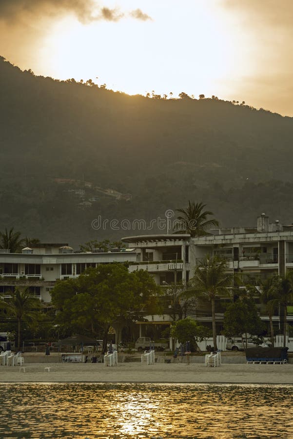 Apartments on the Beachfront in with the Sun Rising Behind Stock Image ...