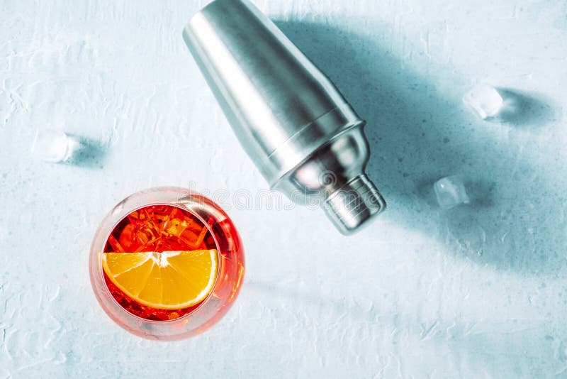 Aperol Cocktail With A Fresh Orange Slice A Shaker And Ice Cubes
