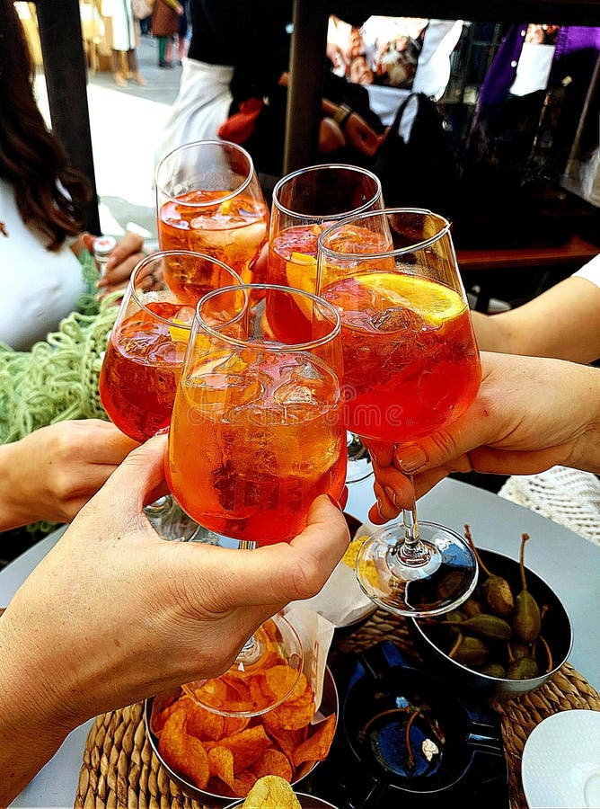 Aperol Spritz in Italy - Cheers! Stock Photo - Image of spritz, cheers ...