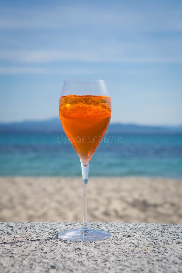 Aperol spritz on seaside stock photo. Image of icecubes - 100334248