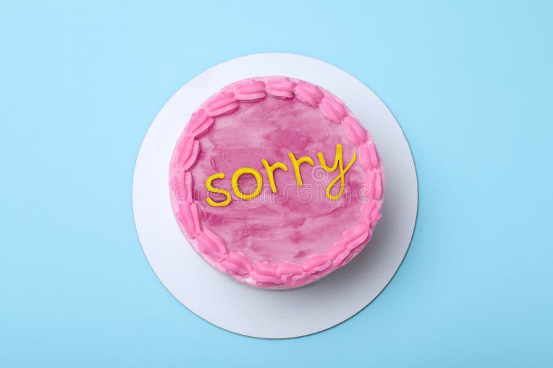 Apology. Cake with Word Sorry of Cream on Light Blue Background, Top ...