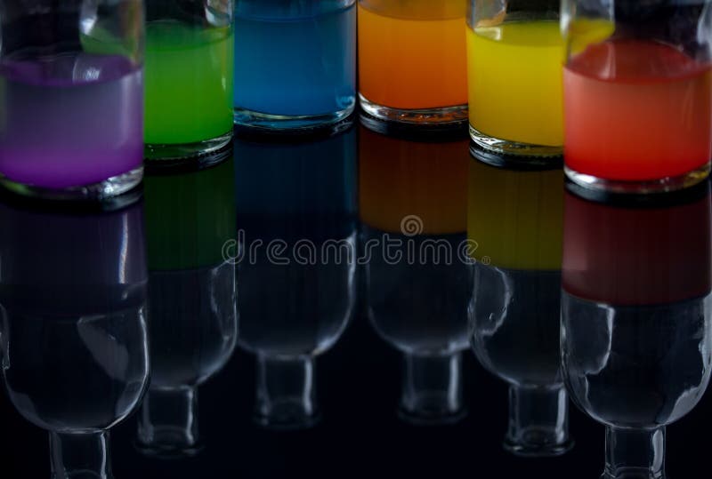 Apothecary, Laboratory Bottles with Colored Liquid with Reflection ...