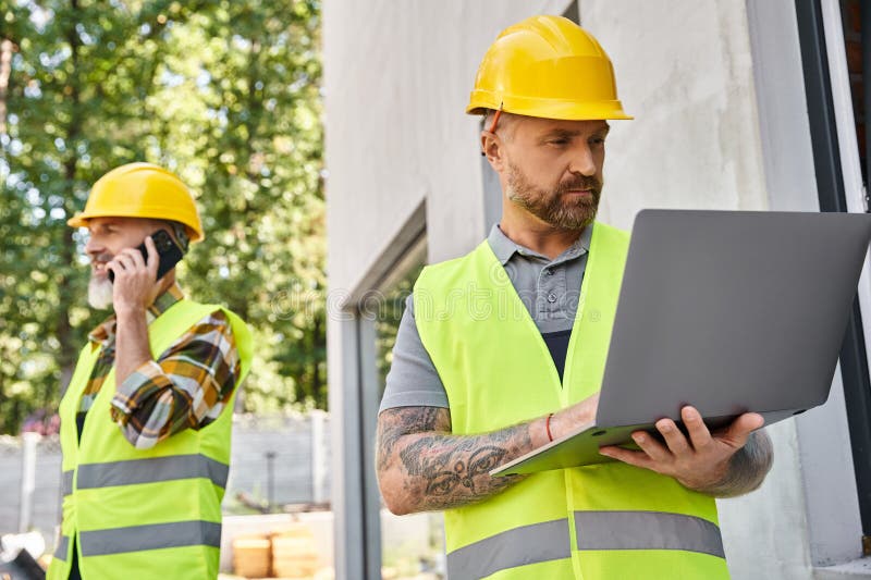 Appealing Builder with Tattoos Working on Stock Photo - Image of ...