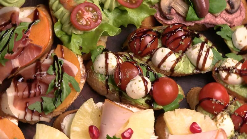 An Appetizer Board with Various Bruschetta for a Buffet: Jamon, Ham ...