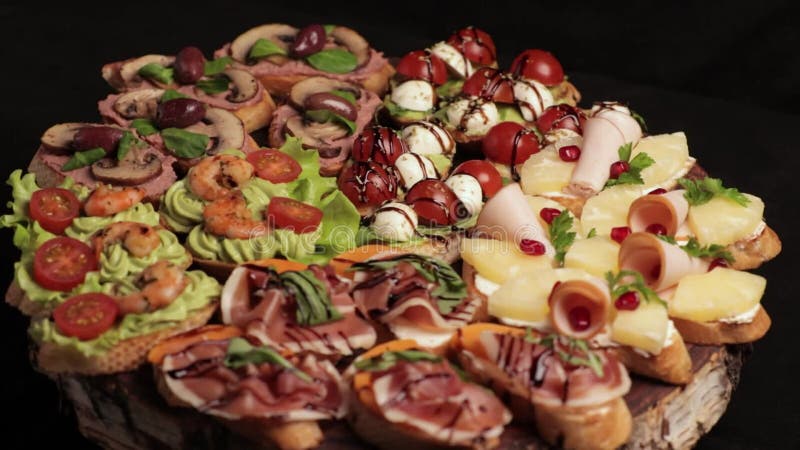 An Appetizer Board with Various Bruschetta for a Buffet: Jamon, Ham ...