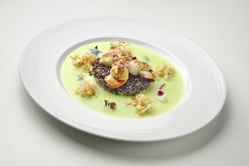 Appetizer Braised Scallops and Black Rice on Pea Cream Stock Image ...