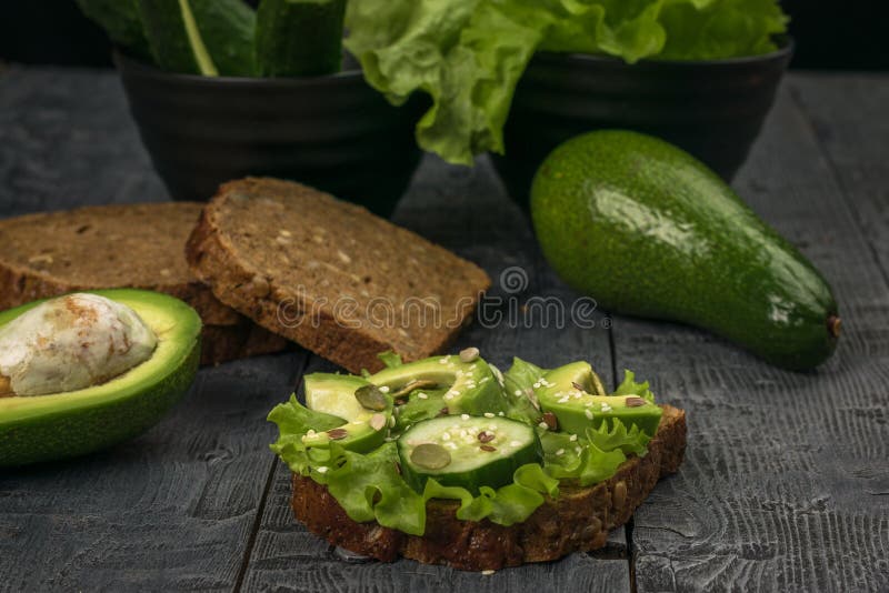 Appetizer of Bread, Lettuce, Cucumbers and Avocado Stock Photo - Image ...