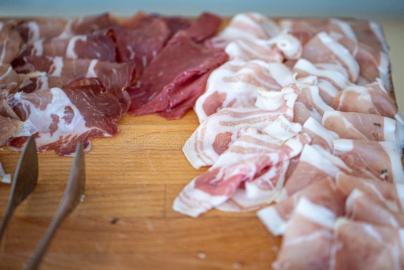 Appetizer of Cold Cuts and Mixed Cold Cuts on a Wooden Chopping Board ...
