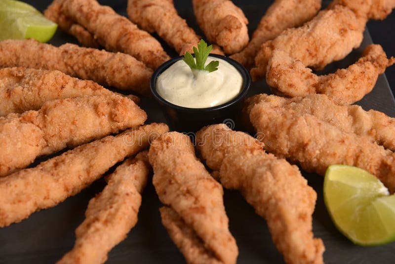 Appetizer of Fried Chicken Strips Breaded with Herb and Lemon Sauce ...