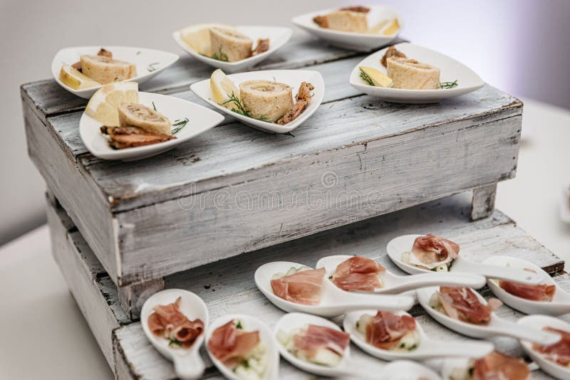 Appetizer Presentation with Assorted Dishes on a Wooden Stand ...
