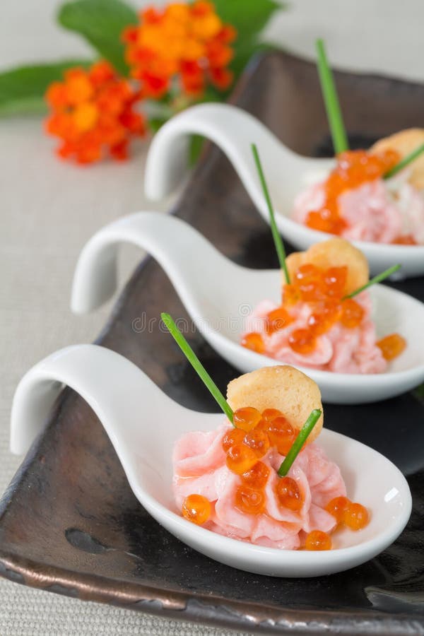 Appetizer with Salmon Mousse and Red Caviar in Serving Spoons Stock ...