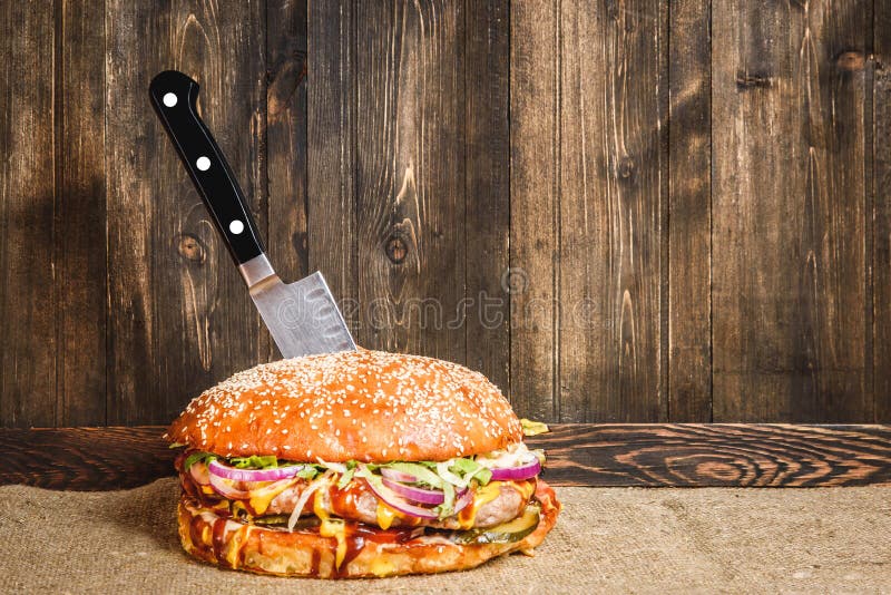 Appetizing Burger with Knife in Stock Image - Image of fast, burger ...
