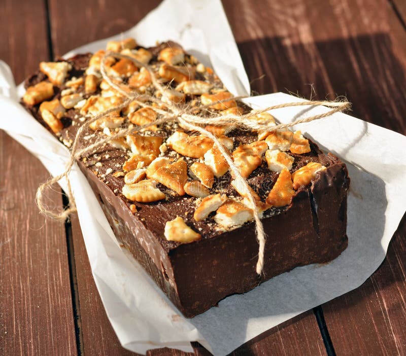 An Appetizing Chocolate Cake Decorated with Small Pieces of Biscuits ...