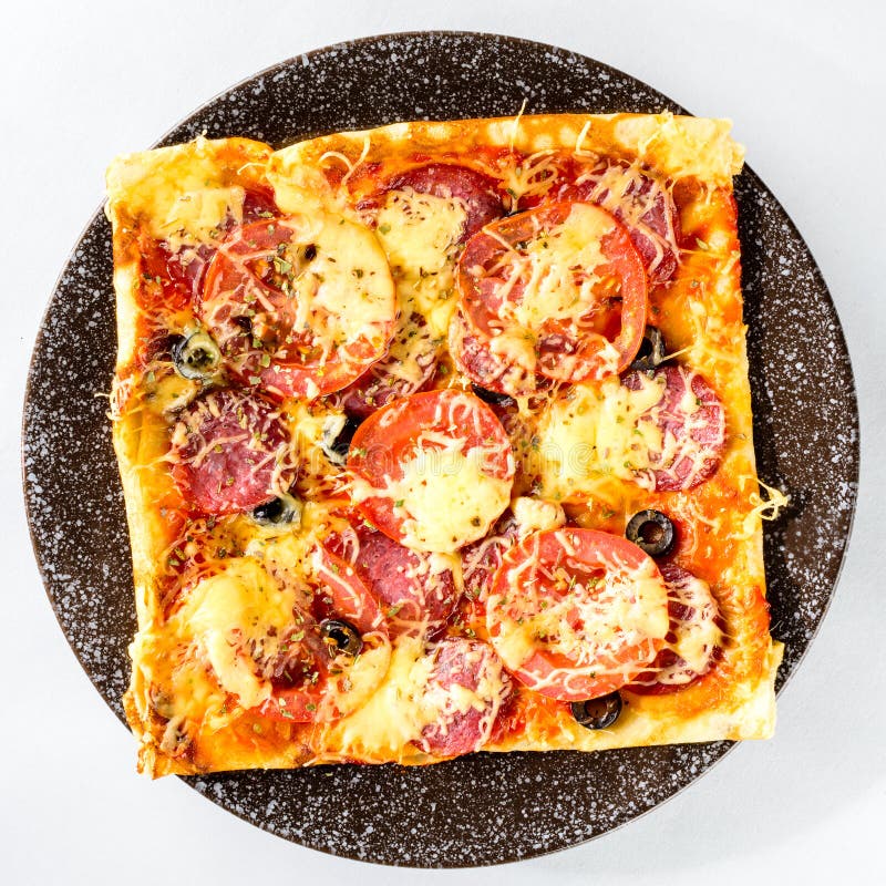 Appetizing Pizza with Salami, Cheese and Tomatoes on Light Backg Stock ...