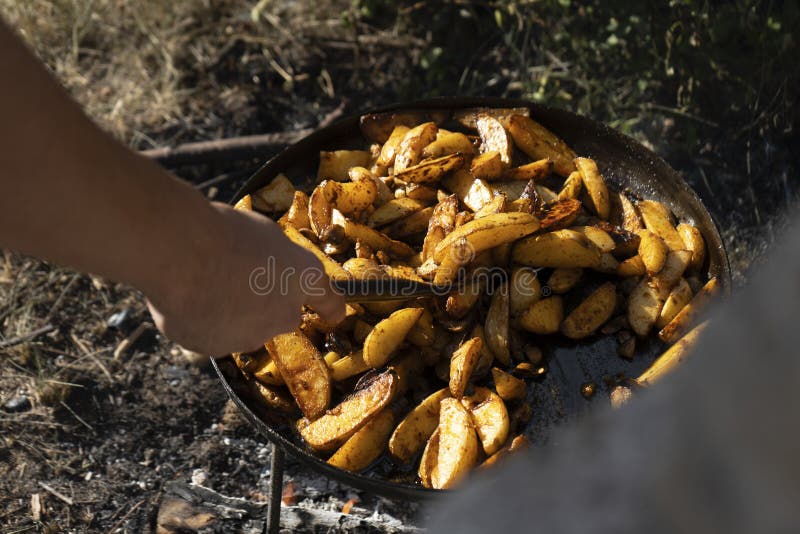 Appetizing Potato Pieces are Fried on an Open Fire until Golden Brown ...