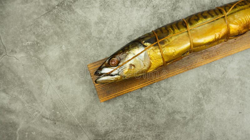 Appetizing Smoked Fish on Kitchen Board.Smoked Fish with Spices Stock ...