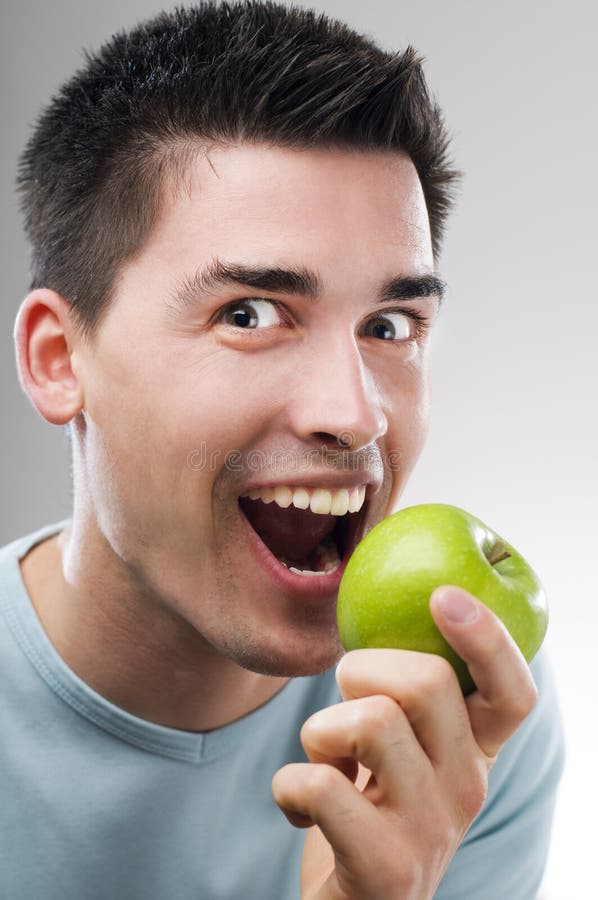 Eating a Green Apple stock image. Image of nutrition, organic - 2133075