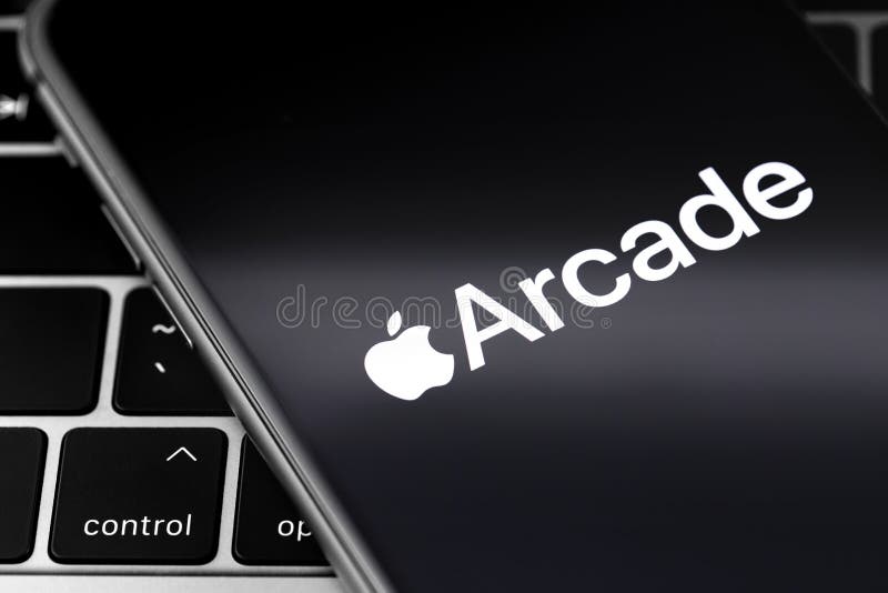 Apple Arcade Logo on the Screen IPhone with Macbook Closeup Editorial ...