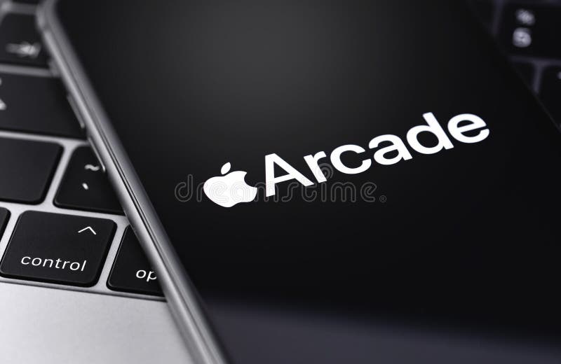 Apple Arcade Logo on the Screen IPhone with Macbook Closeup Editorial ...